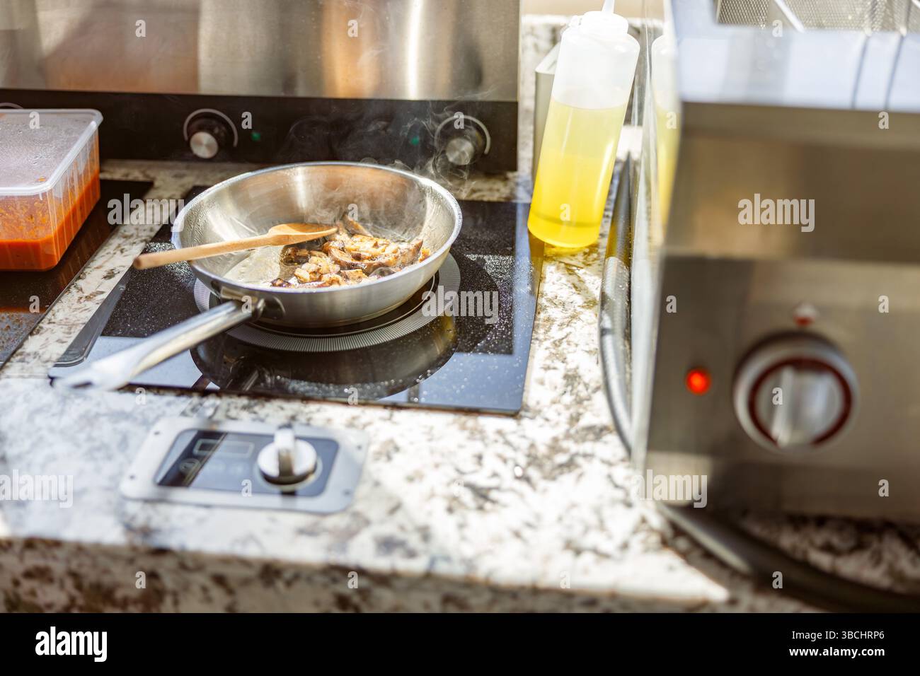Cooking on a Modern Kitchen Countertop Using Fresh, Quality Ingredients ...