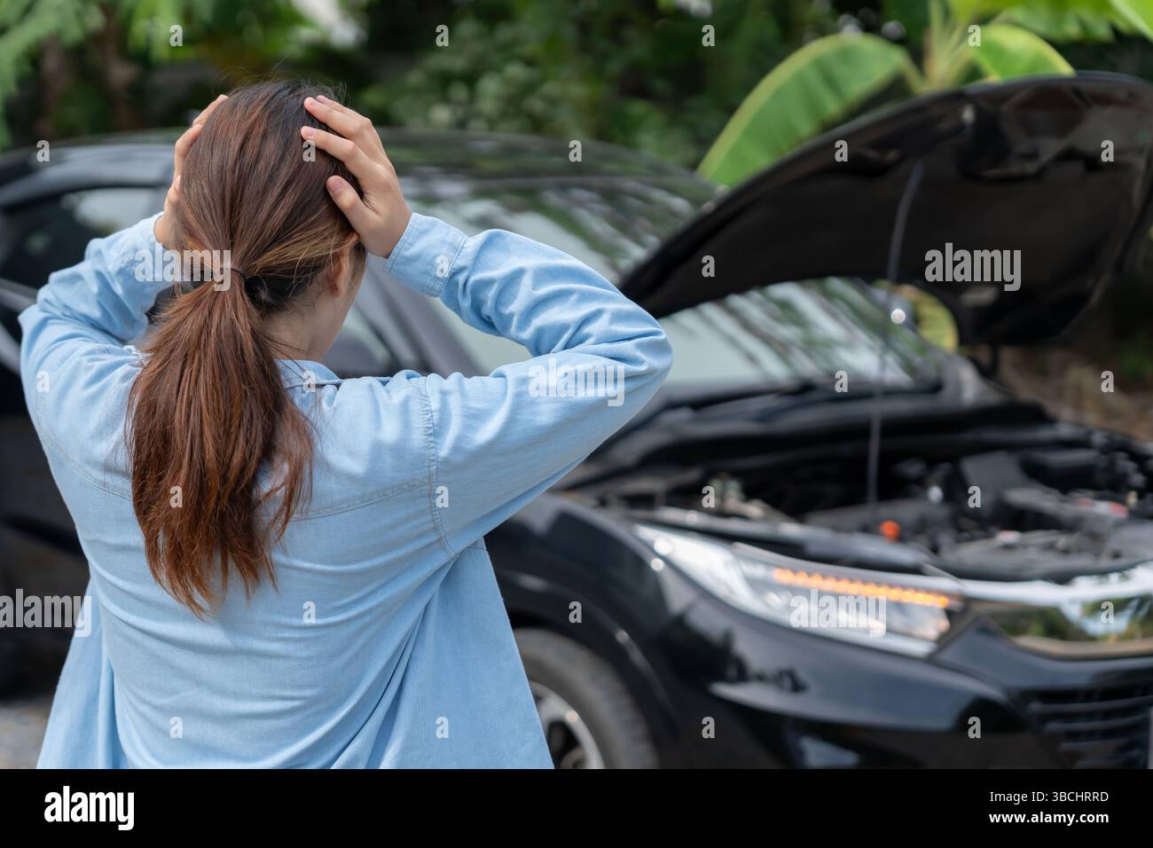 breakdown, broken car, repair. Stress Woman look engine during car ...
