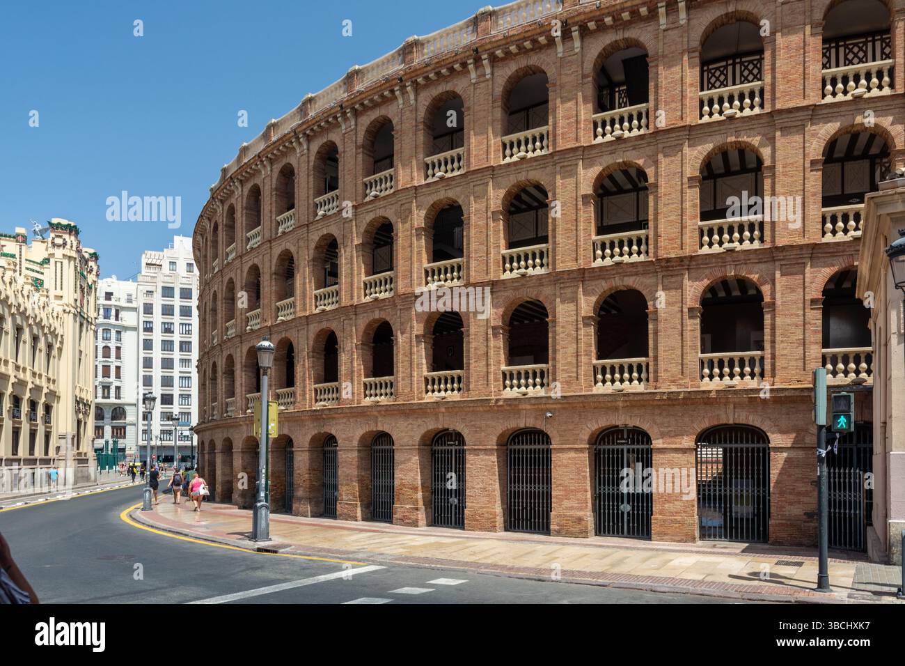Valencia, Spain – August 12, 2022: Sunlit brick arches of the Plaza de ...