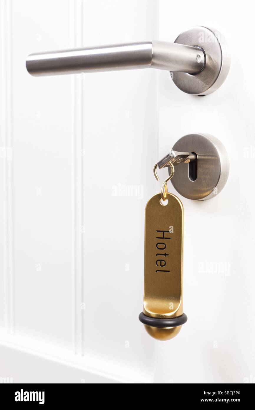 A hotel key is stuck in the room lock Stock Photo - Alamy