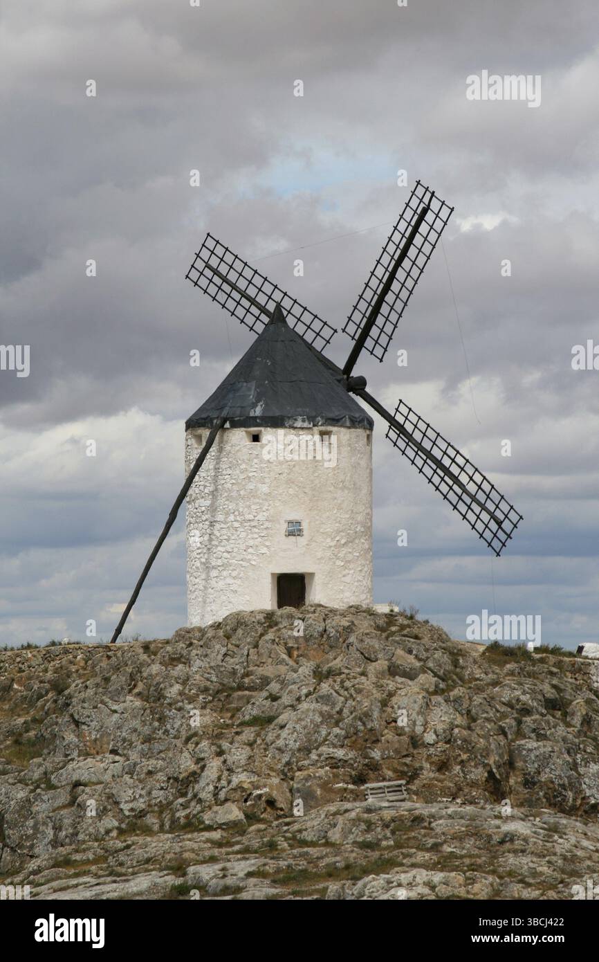 Tower windmill on a rock base in Spain Stock Photo - Alamy