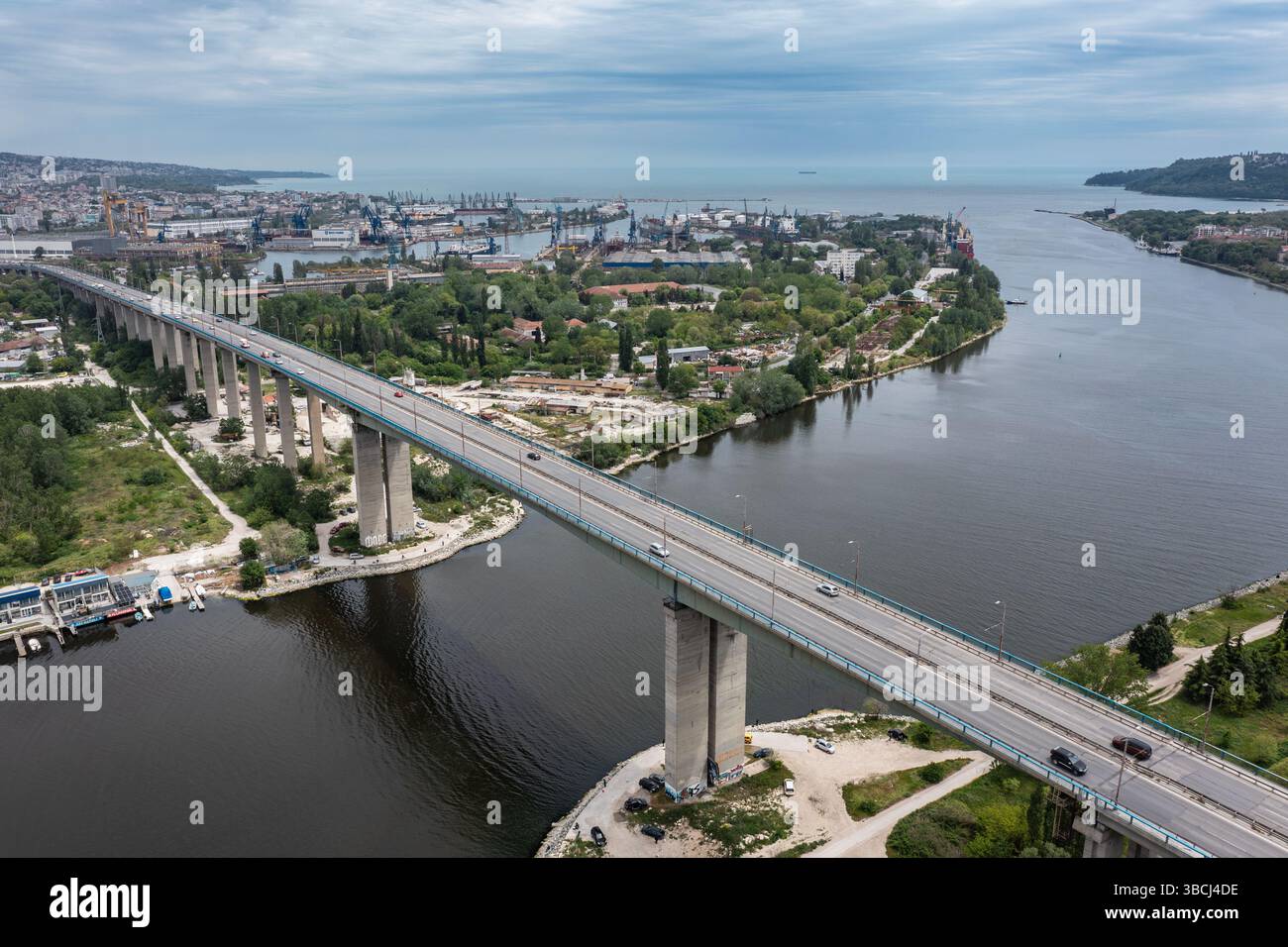 Aerial view of bridge with cars passes above the lake in Varna ...