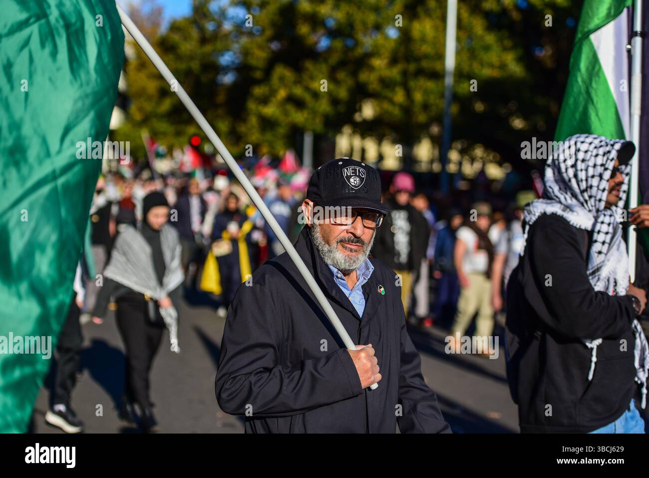 A man carrying a flag seen during Nakba day Pro-Palestinian protest at ...