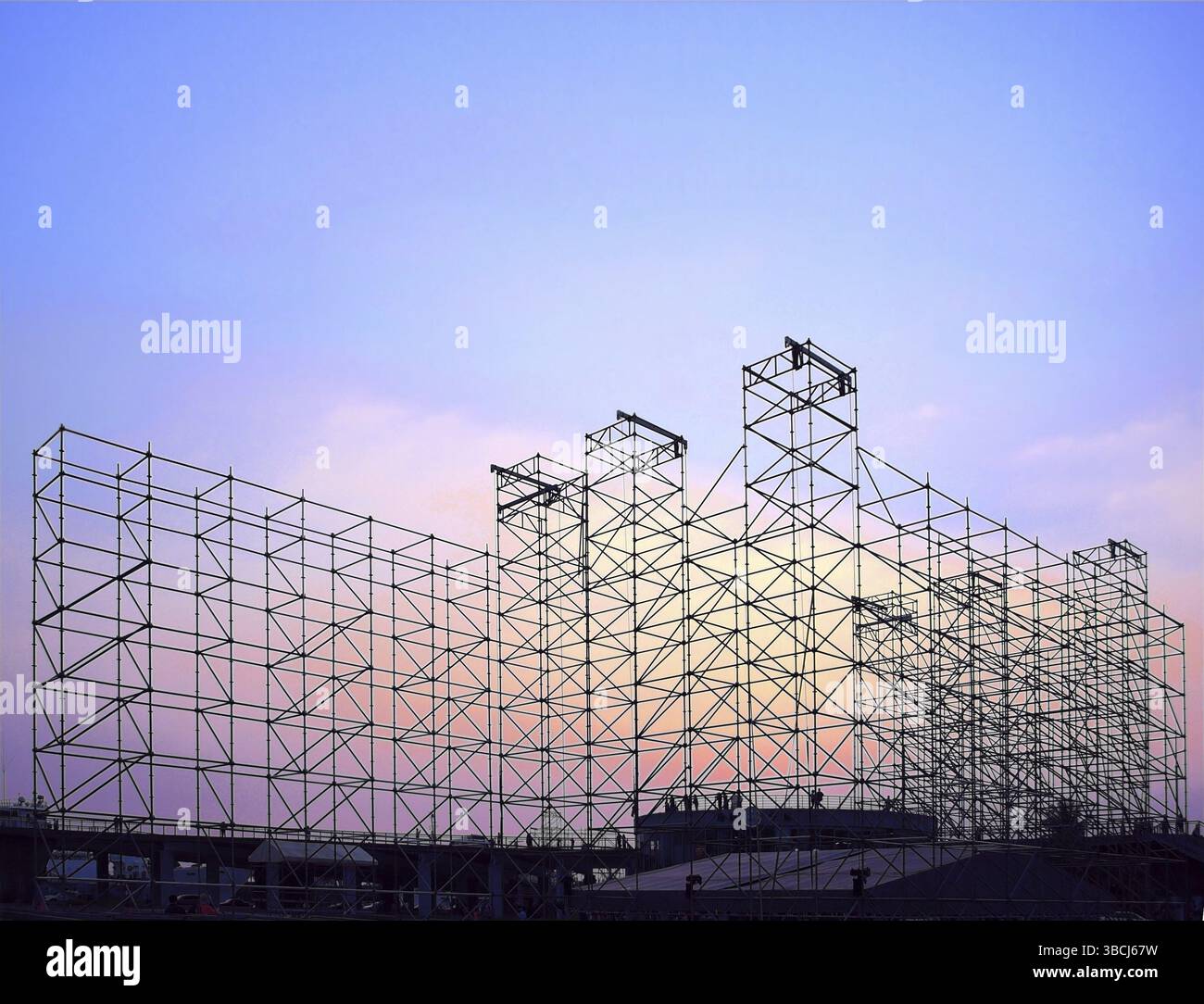 Complex scaffolding setup for a stage for an outdoor concert seen at ...