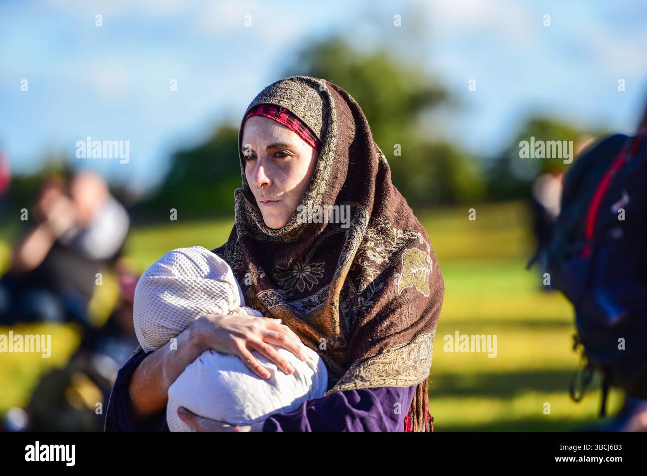 A woman seen holding a mock baby as they protest during Nakba day Pro ...