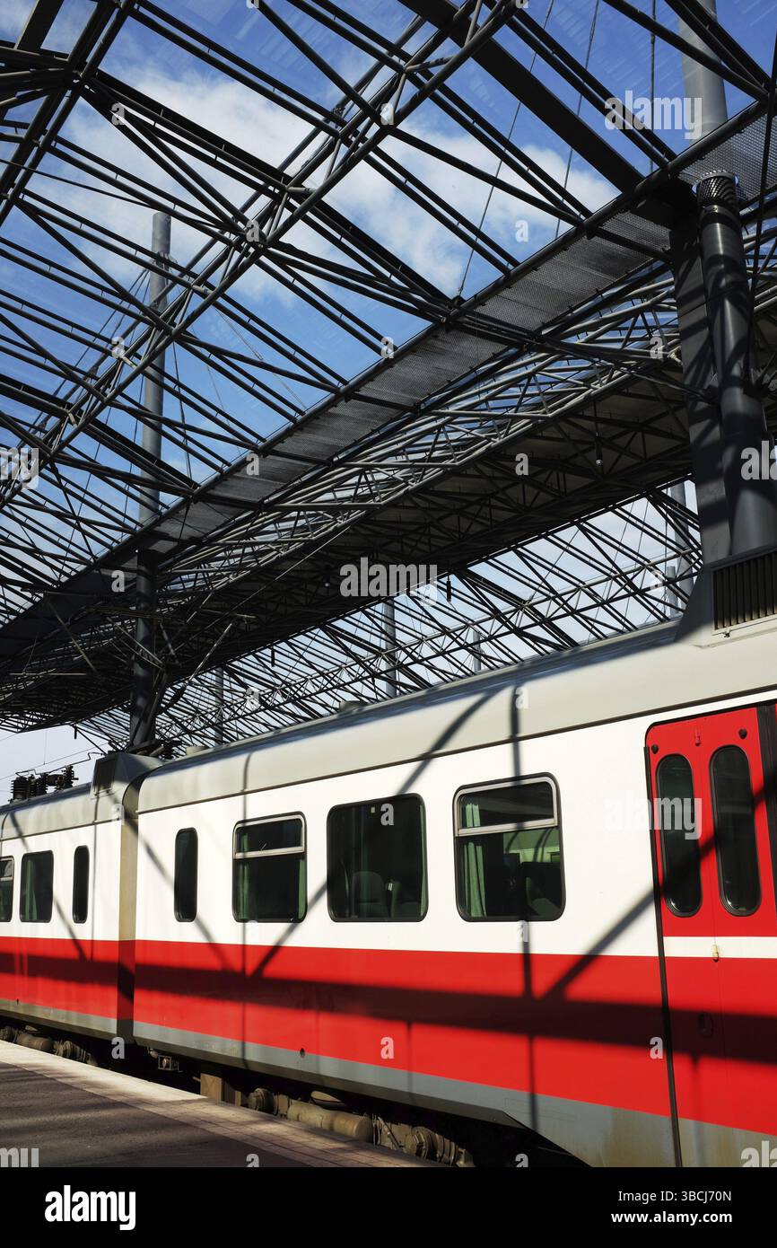 Carriages of a passenger train under a glass roof station Stock Photo ...