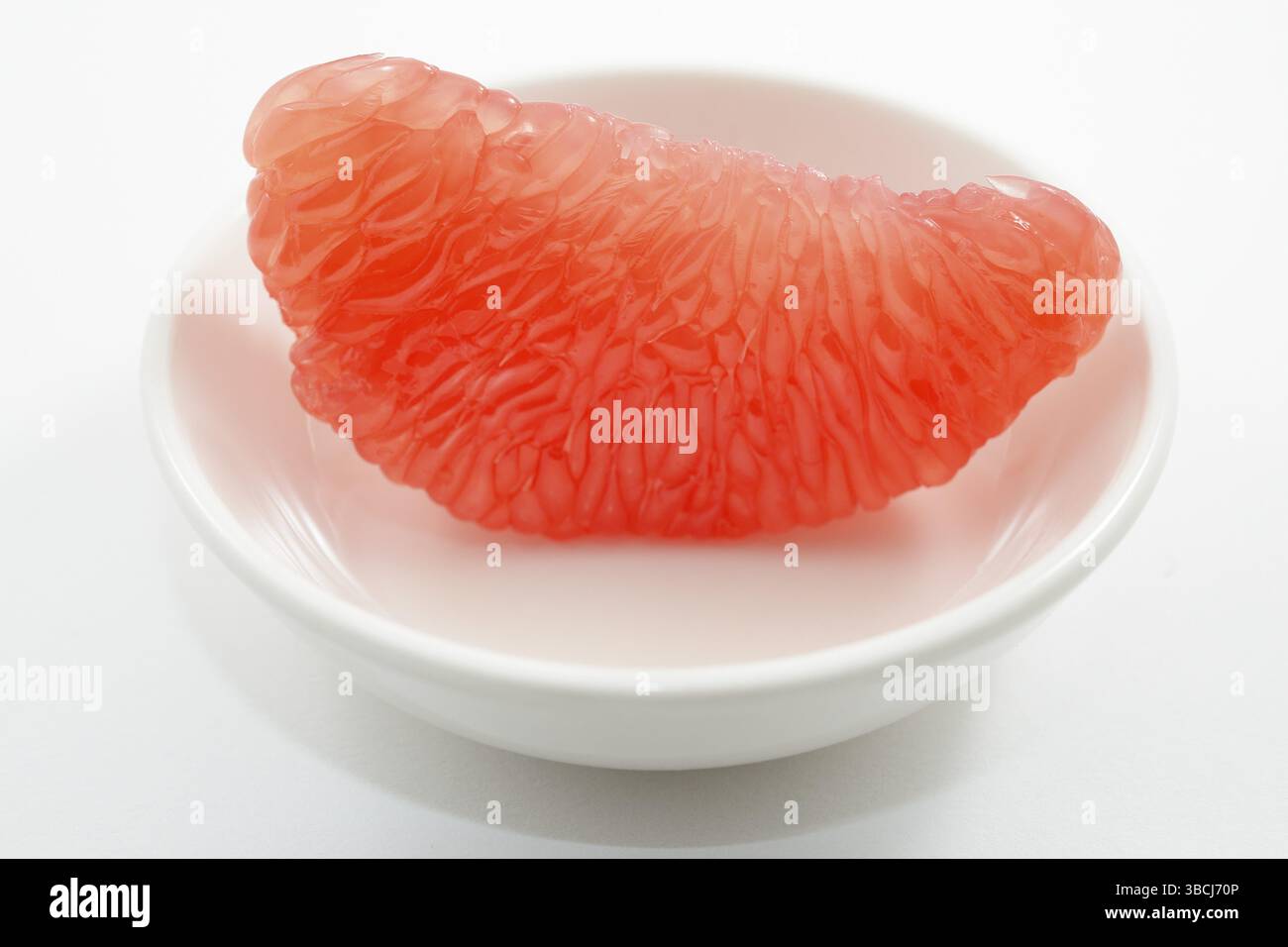 Slice red juicy grapefruit hi-res stock photography and images - Alamy