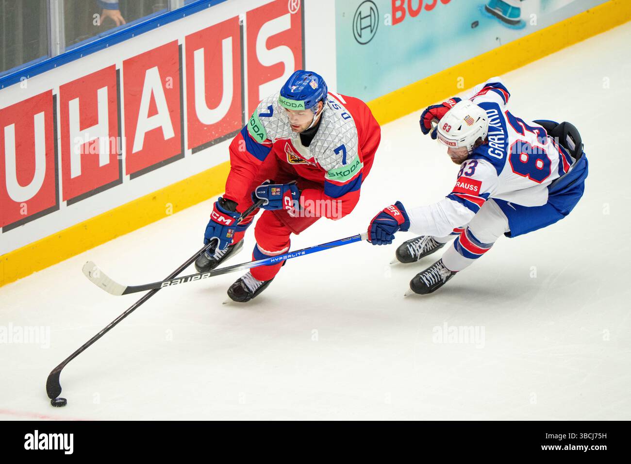 Czech Republic's David Spacek, left, skates ahead of United State's ...