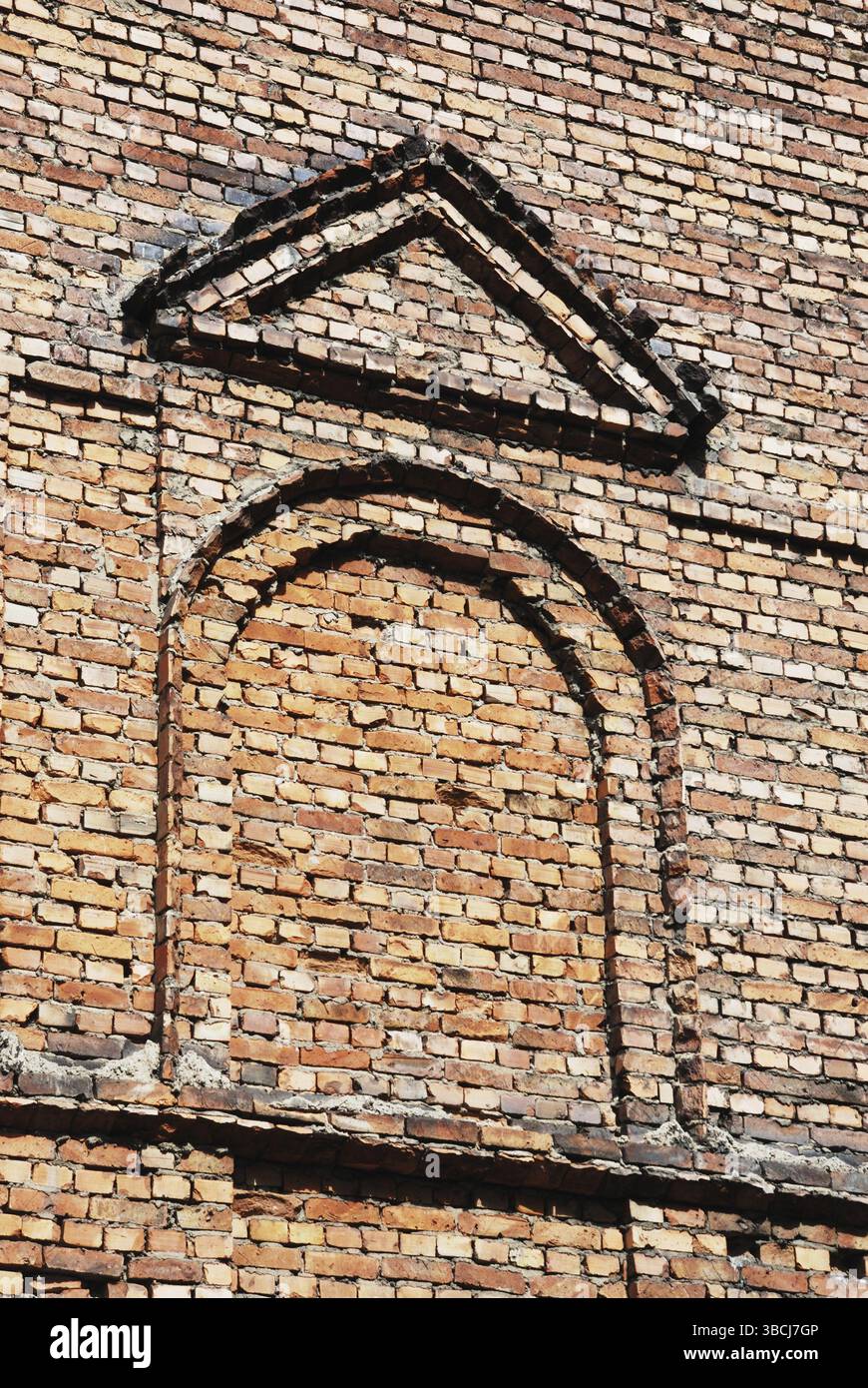 Ancient wall of brick with round false arch Stock Photo - Alamy