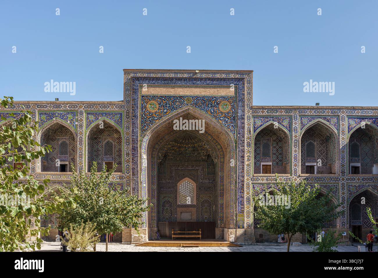 The main facade of Sherdor Madrasa in Samarkand, Uzbekistan, displays ...
