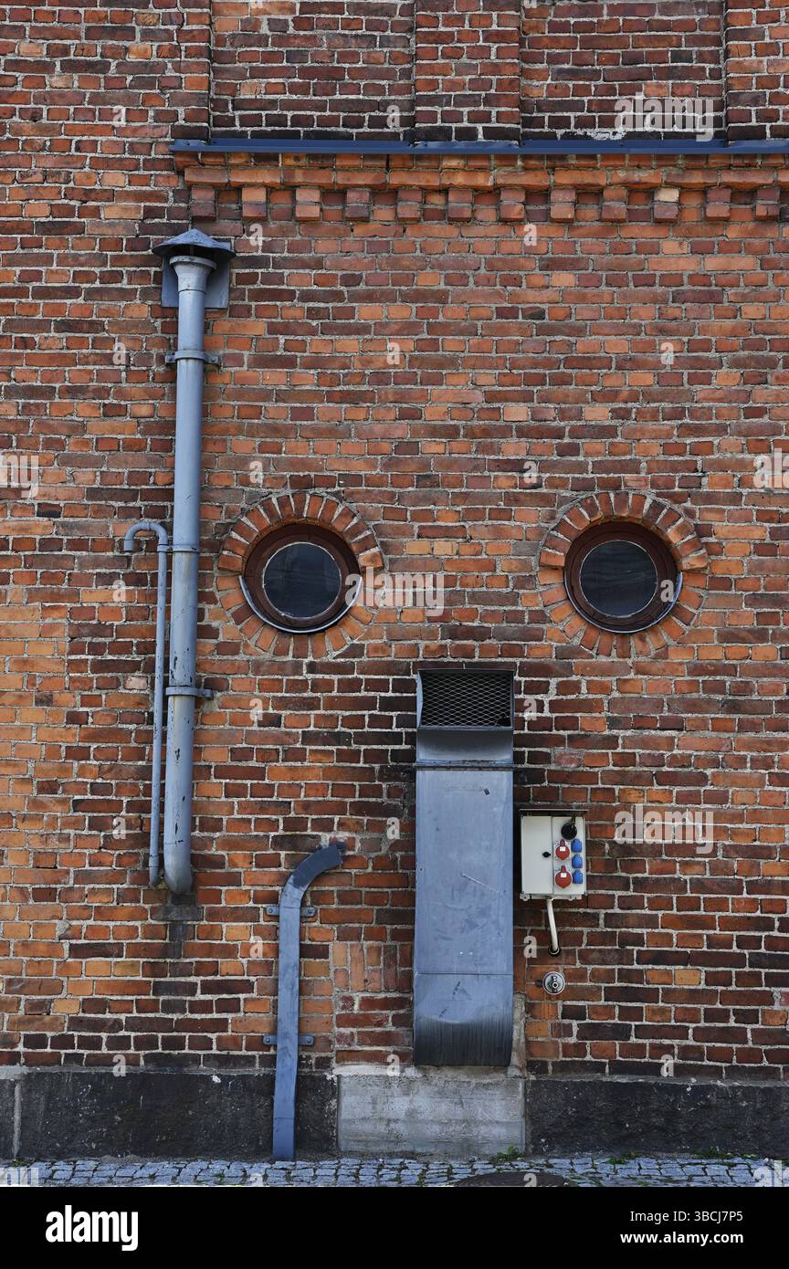 Brick wall pipes hi-res stock photography and images - Alamy