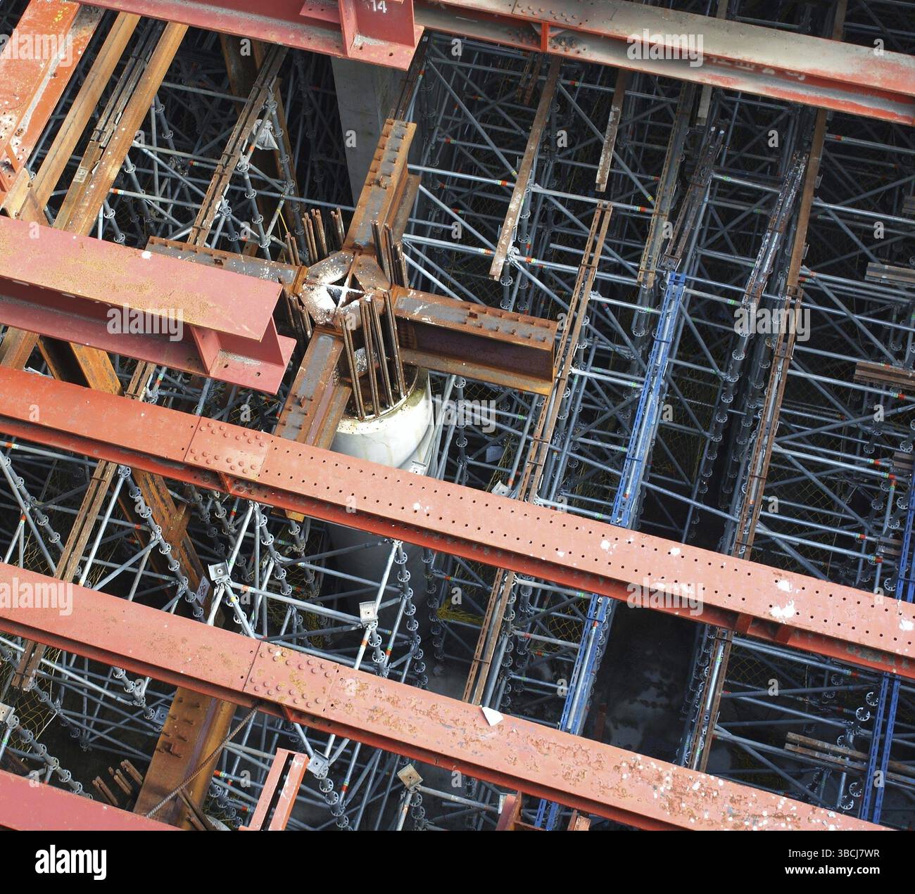 A large underground construction site with massive pillars and girders ...