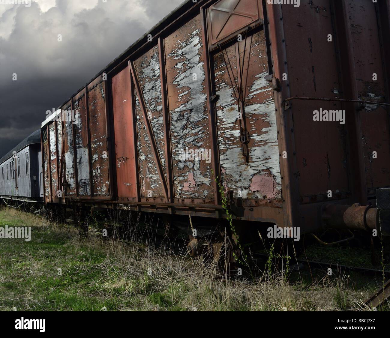 Old shabby railroad cars in a dead end Stock Photo - Alamy