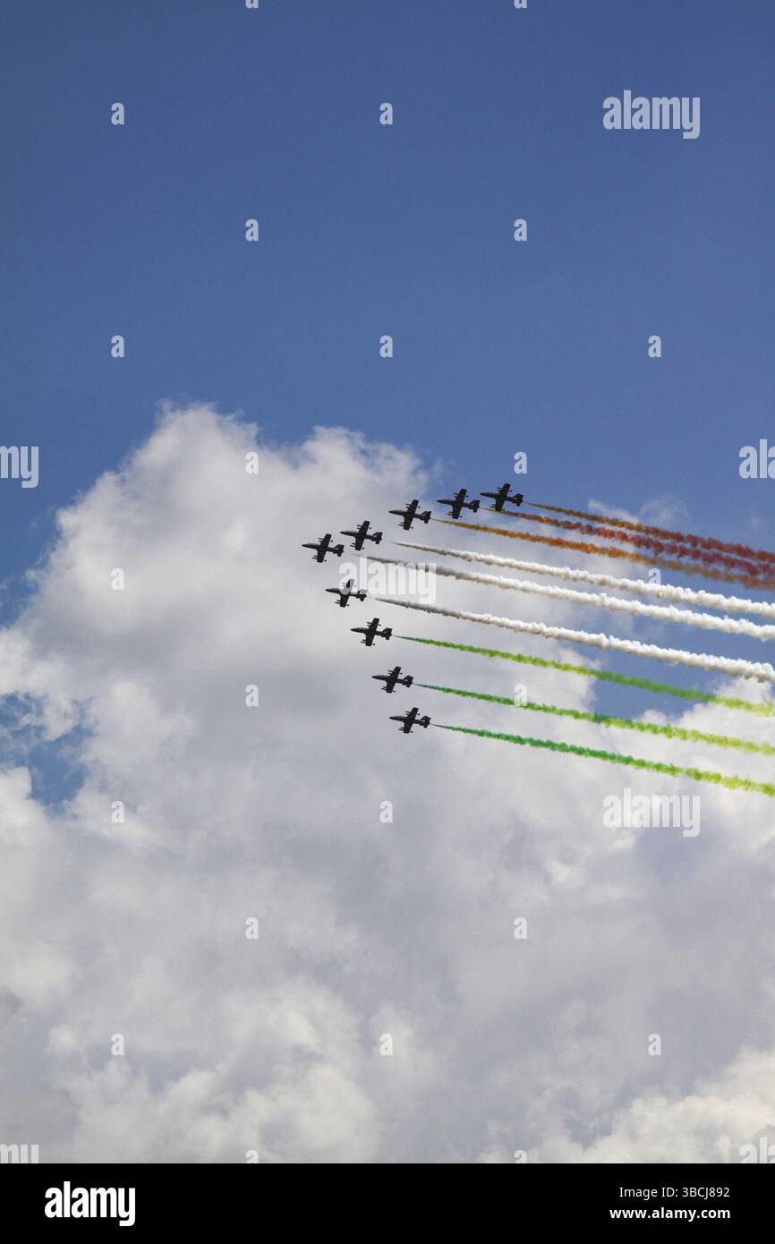 Squadrons of aircraft release colourful smoke at air show Stock Photo ...