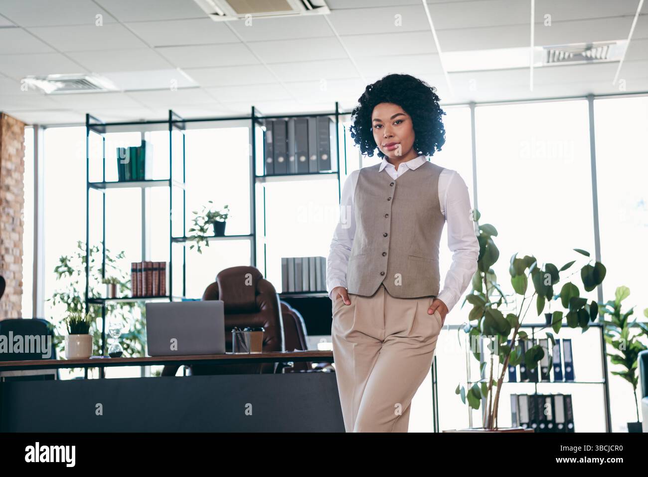 Professional businesswoman dressed in formal attire standing ...