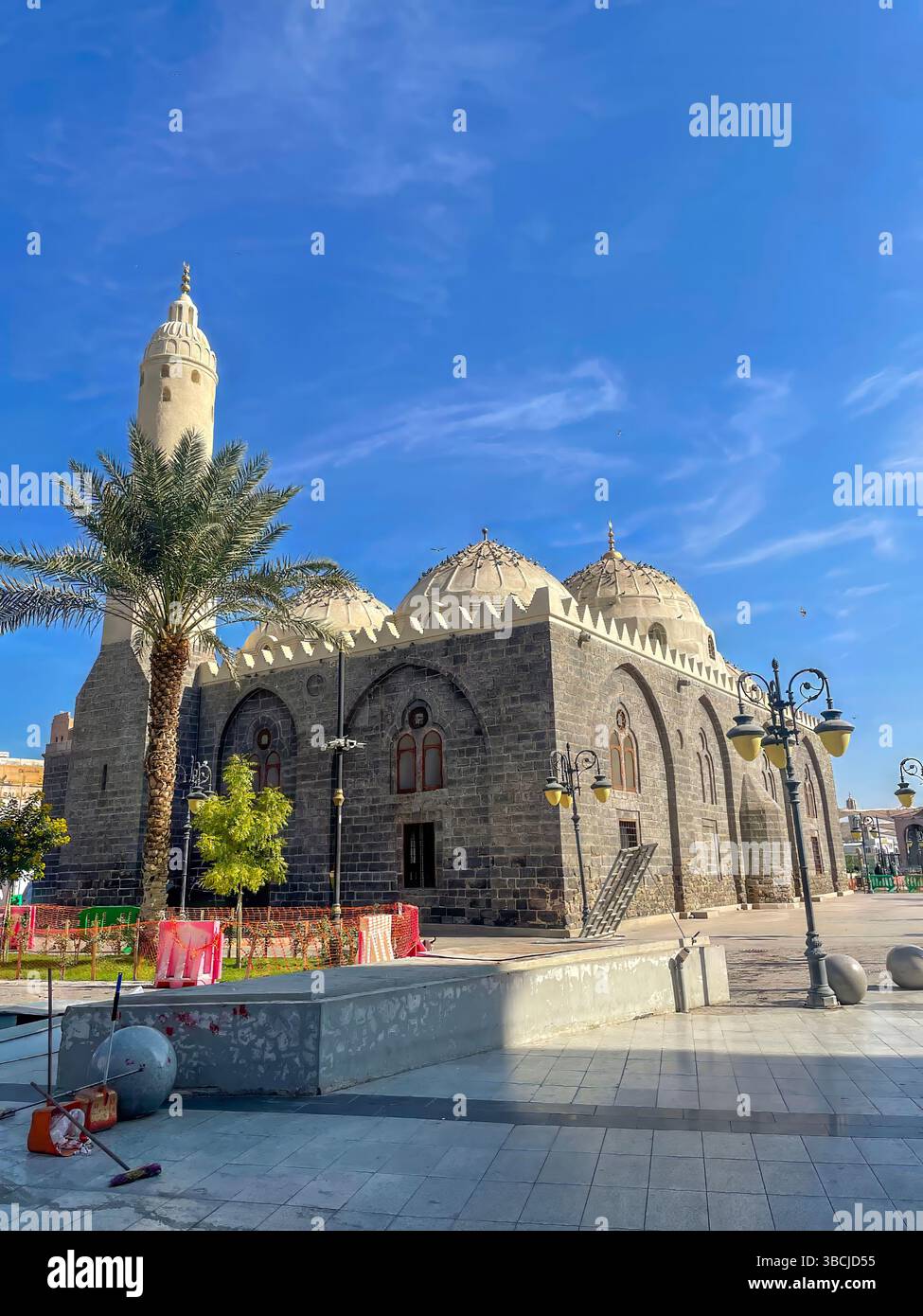 Mosque of Al-Ghamama with domes and minaret under clear blue sky.this ...
