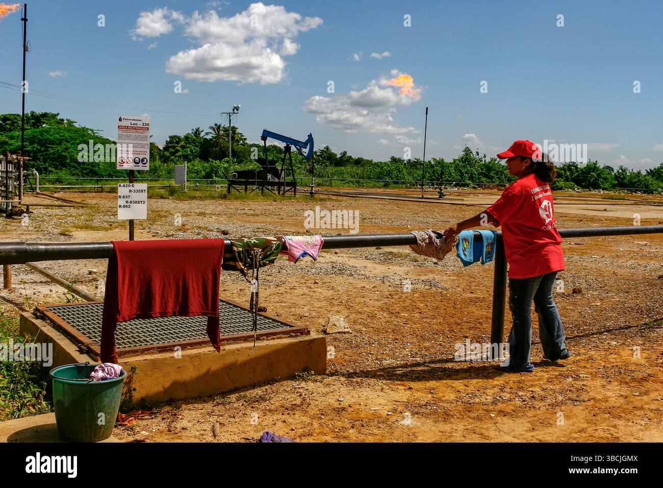 Cabimas, Zulia, Venezuela. 29-11-2025.A Venezuelan woman hangs her ...