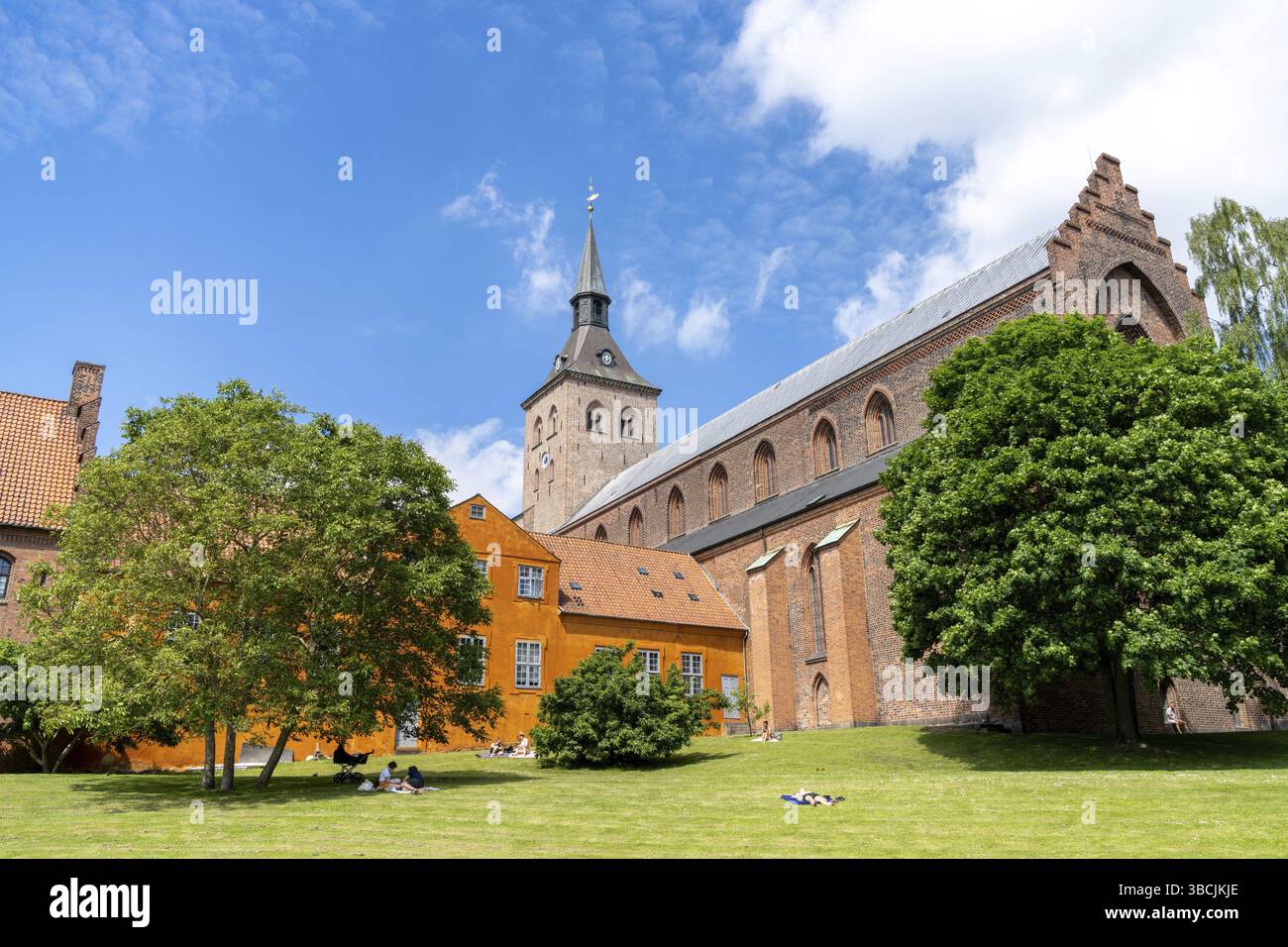 Odense, Denmark - 9 June, 2021: the city park and cathedral of Saint ...
