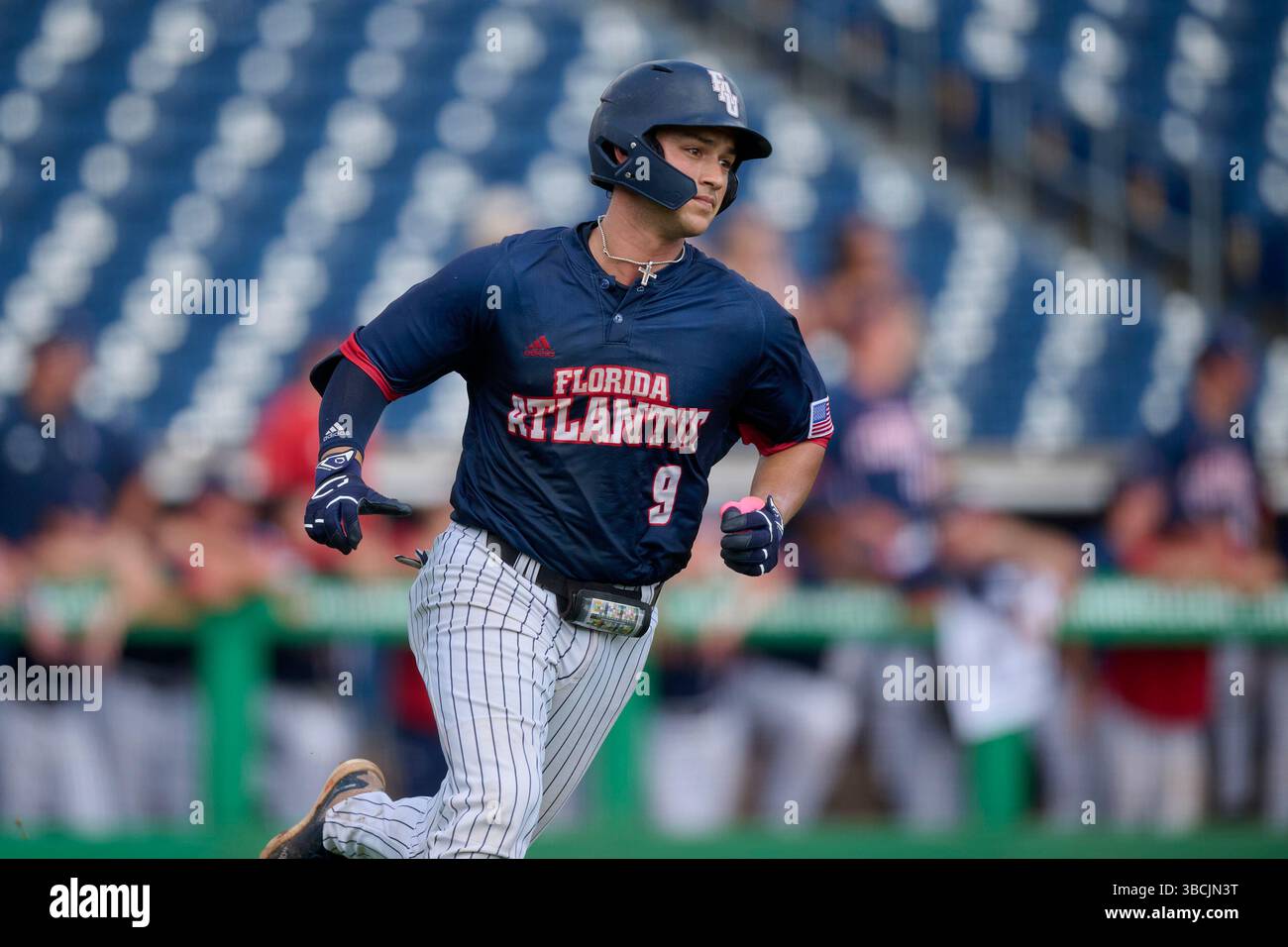 Florida Atlantic Owls Nick Romano (9) runs to first base during an NCAA ...