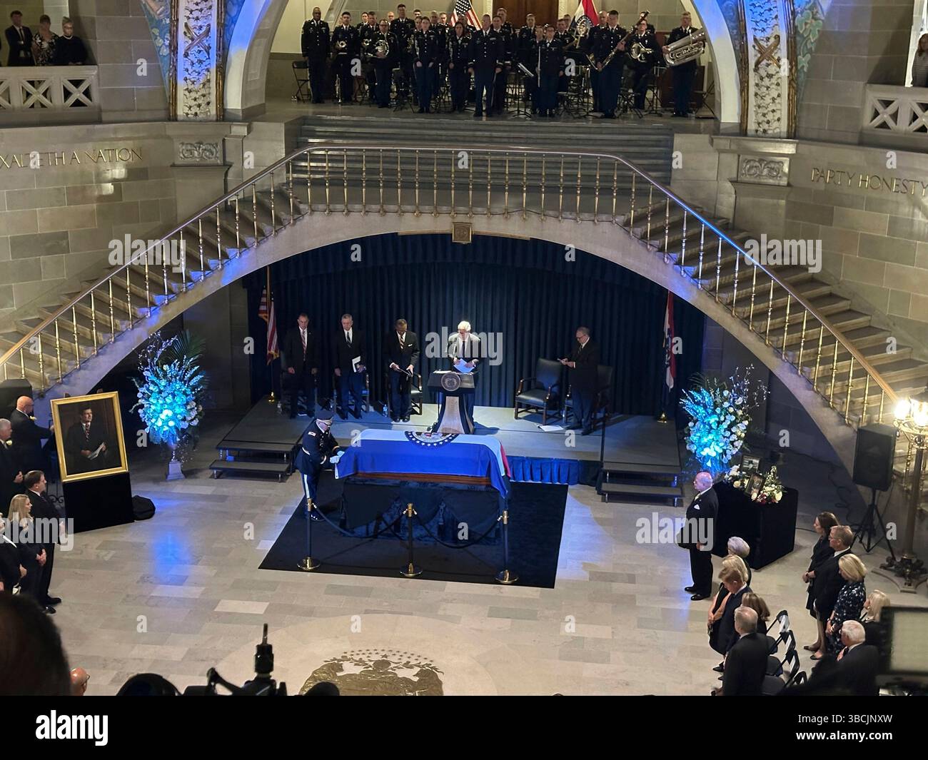 An officer stands by the casket of former Missouri Gov. and U.S. Sen ...