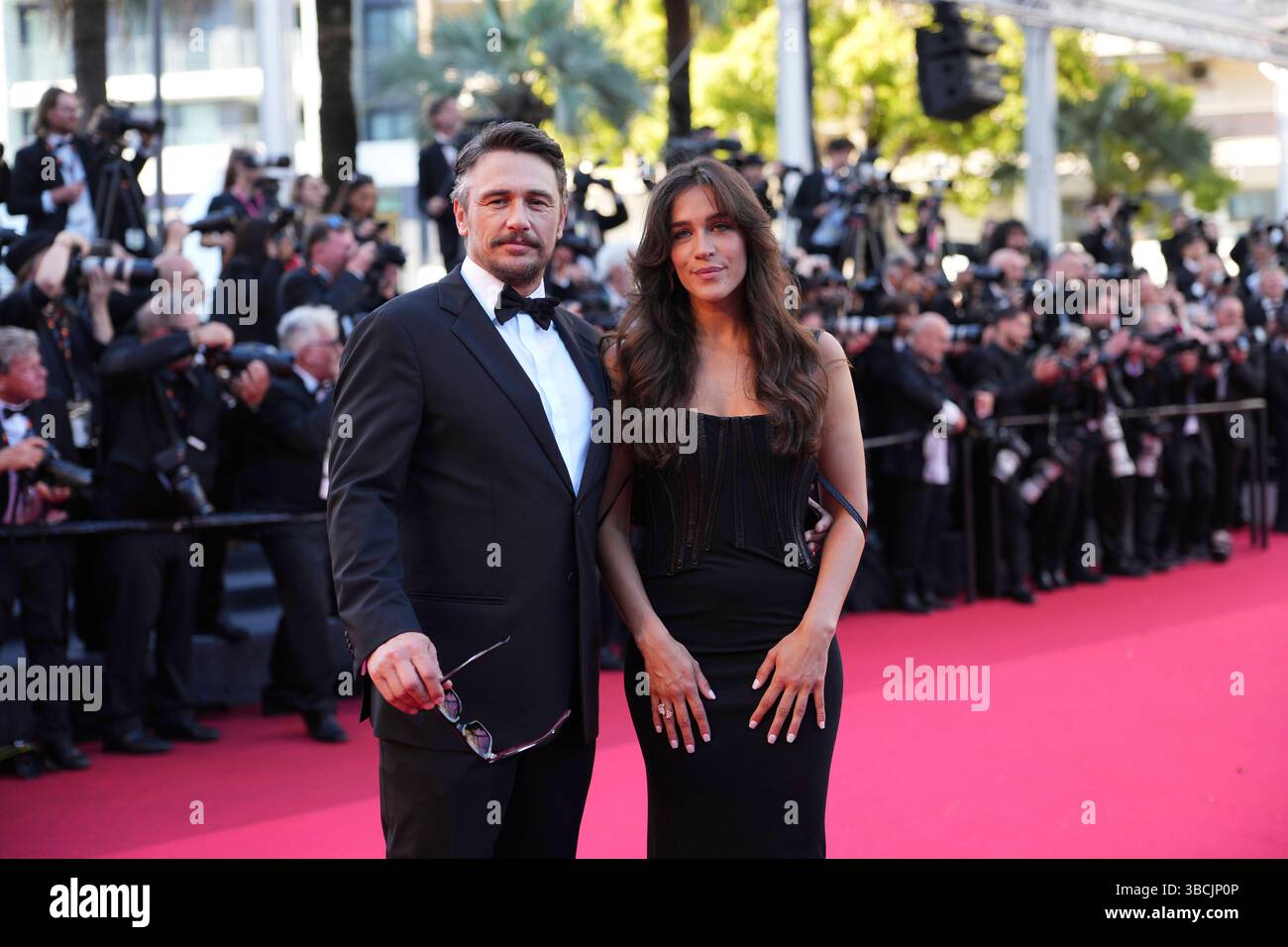 James Franco, left, and Izabel Pakzad pose for photographers upon ...