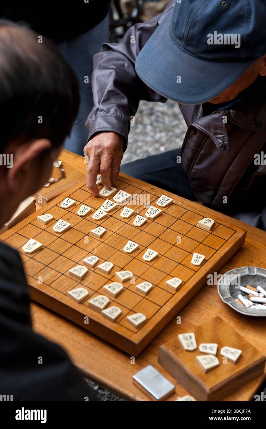 Competitors challenging each other to a strategy board game called ...