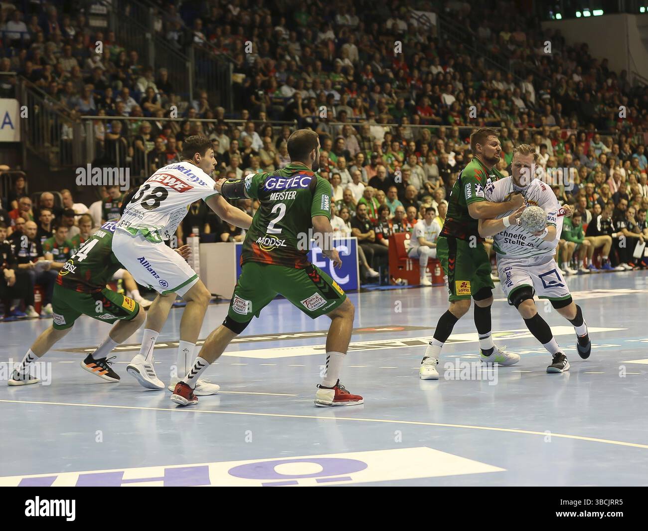 Slovenian handball player Marko Bezjak (SCM) and German handball player ...