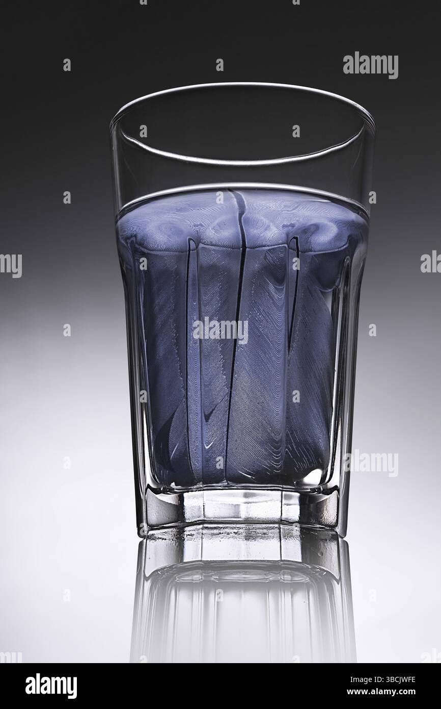 Simple water-glass with structured water in blue Stock Photo - Alamy