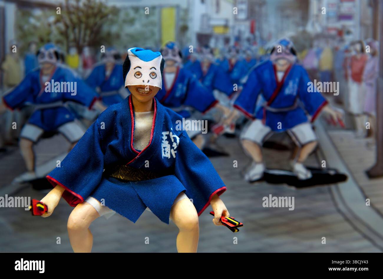 Miniature diorama of Japanese Yosakoi summer festival dancers in yukata ...