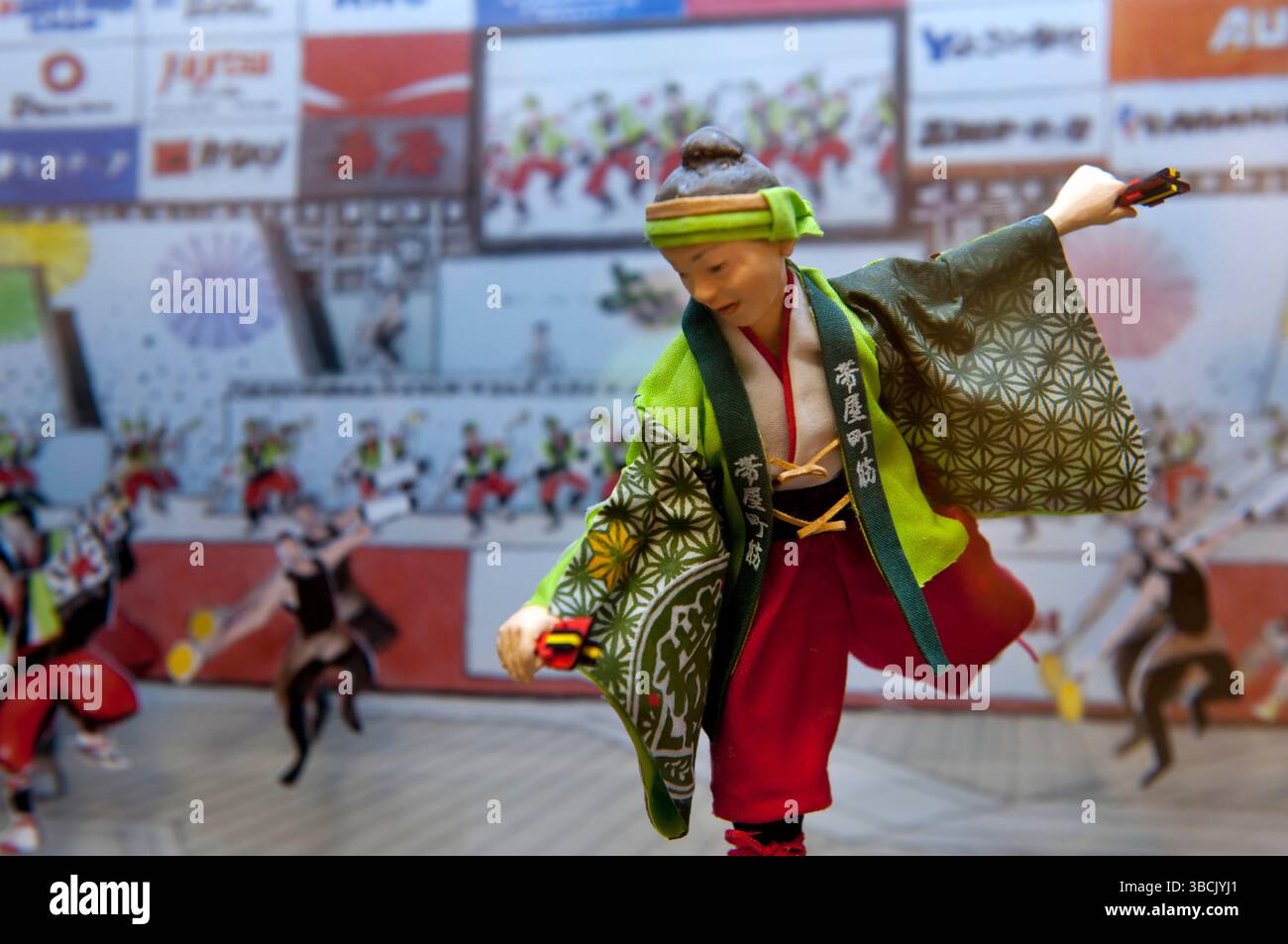 Miniature diorama of Japanese Yosakoi summer festival dancers in yukata ...