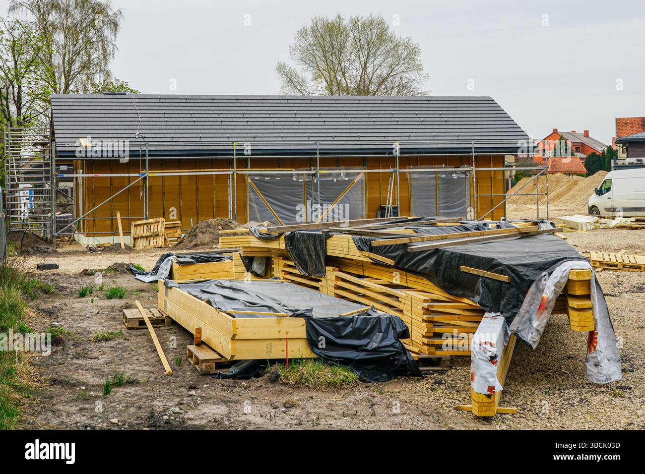 Single Story Wooden House Construction Progress with Stacked Timber in ...