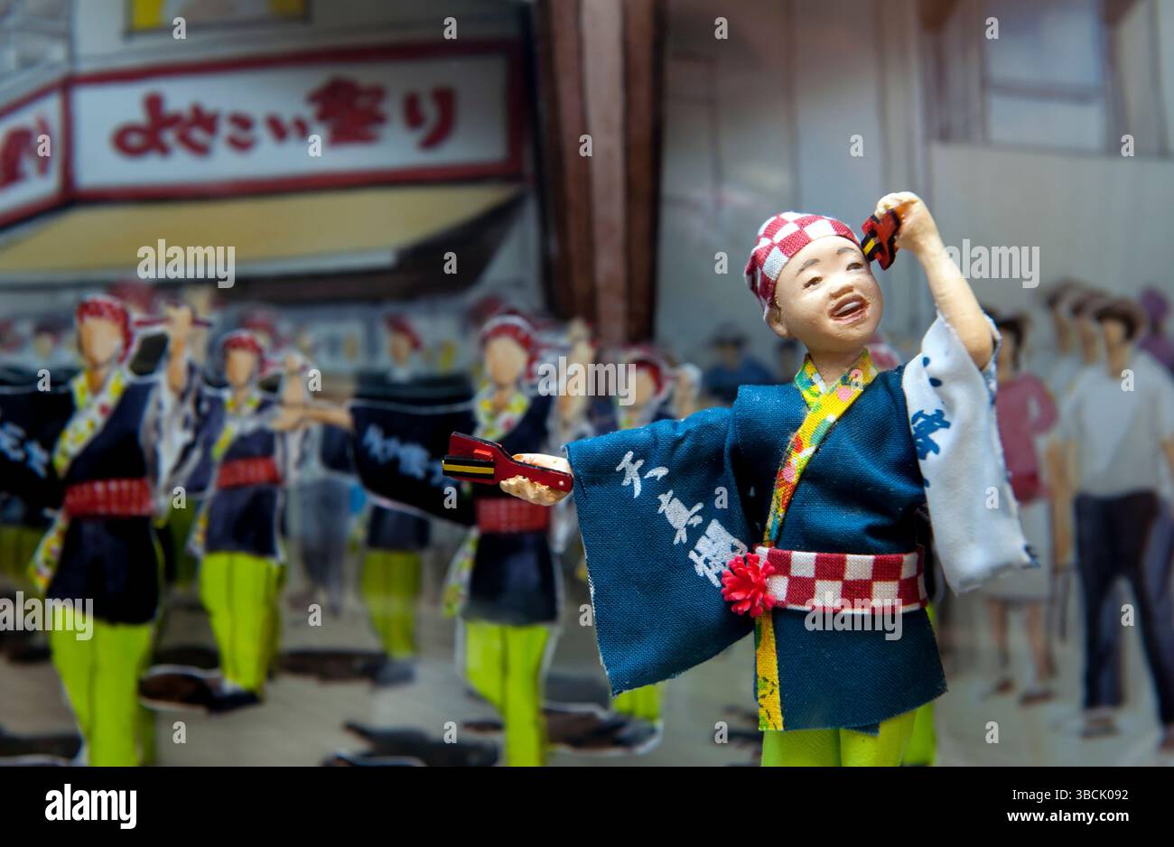 Miniature diorama of Japanese Yosakoi summer festival dancers in yukata ...