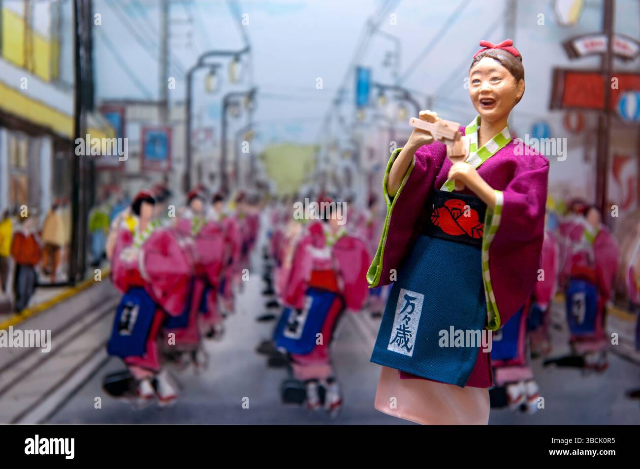 Miniature diorama of Japanese Yosakoi summer festival dancers in yukata ...