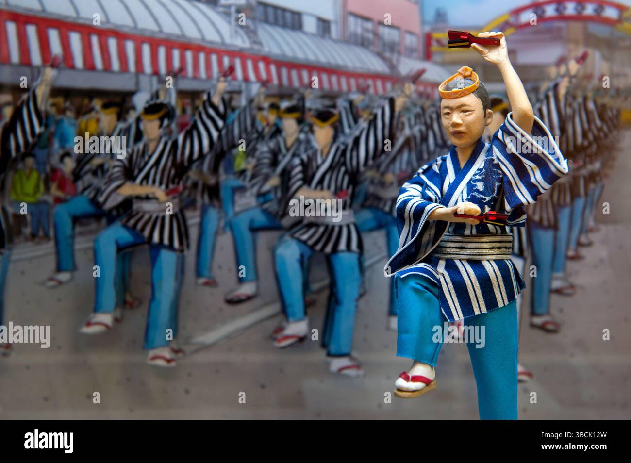 Miniature diorama of Japanese Yosakoi summer festival dancers in yukata ...