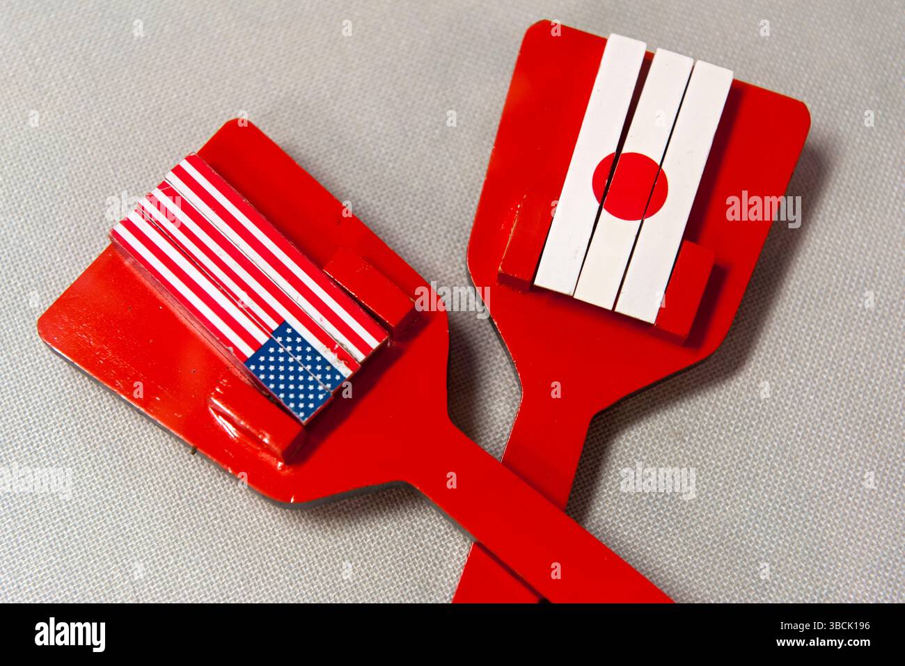 An American flag and Japanese flag design on "naruko" handheld wooden ...