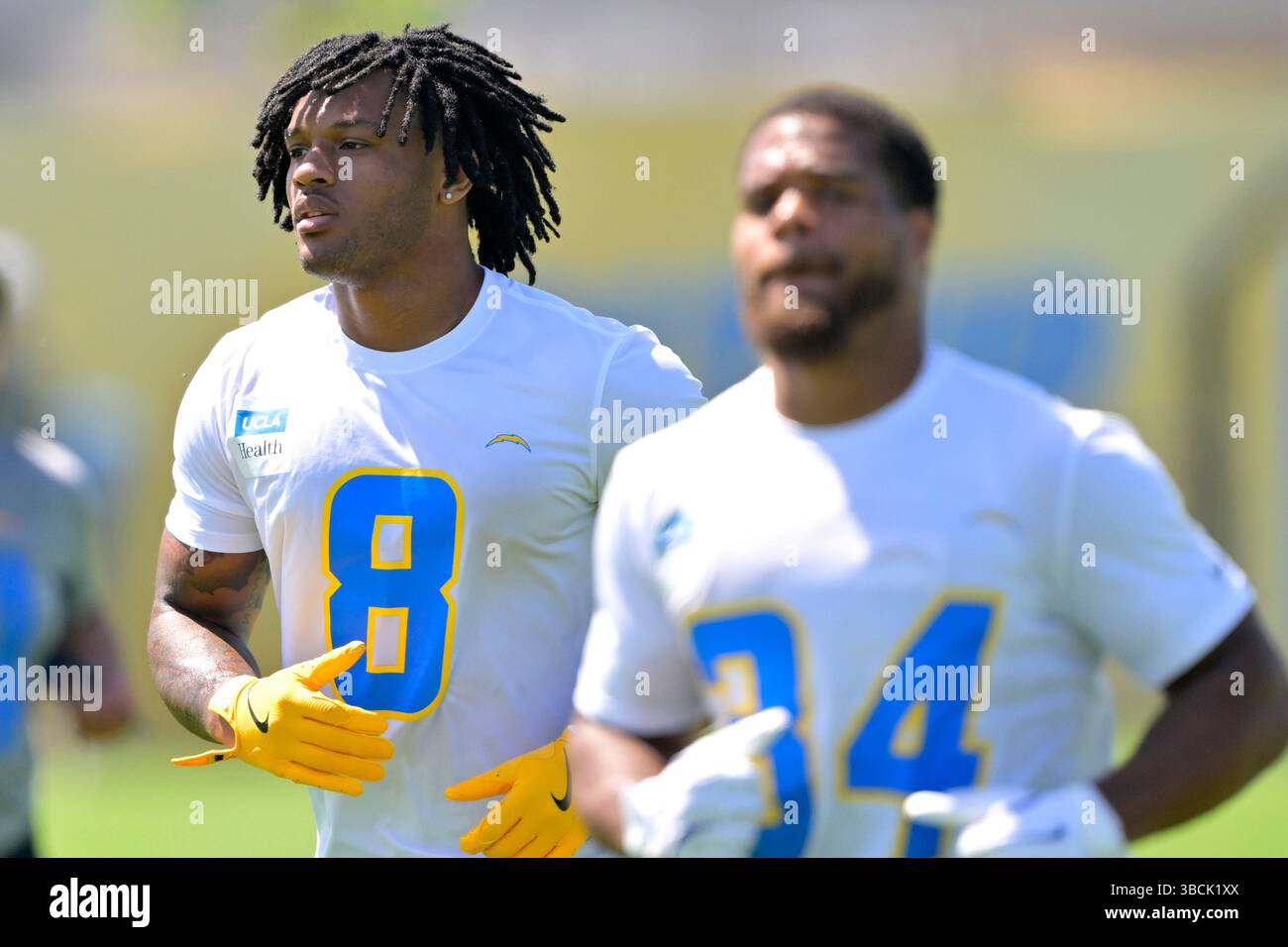 Los Angeles Chargers running back Omarion Hampton (8) jogs on the field ...