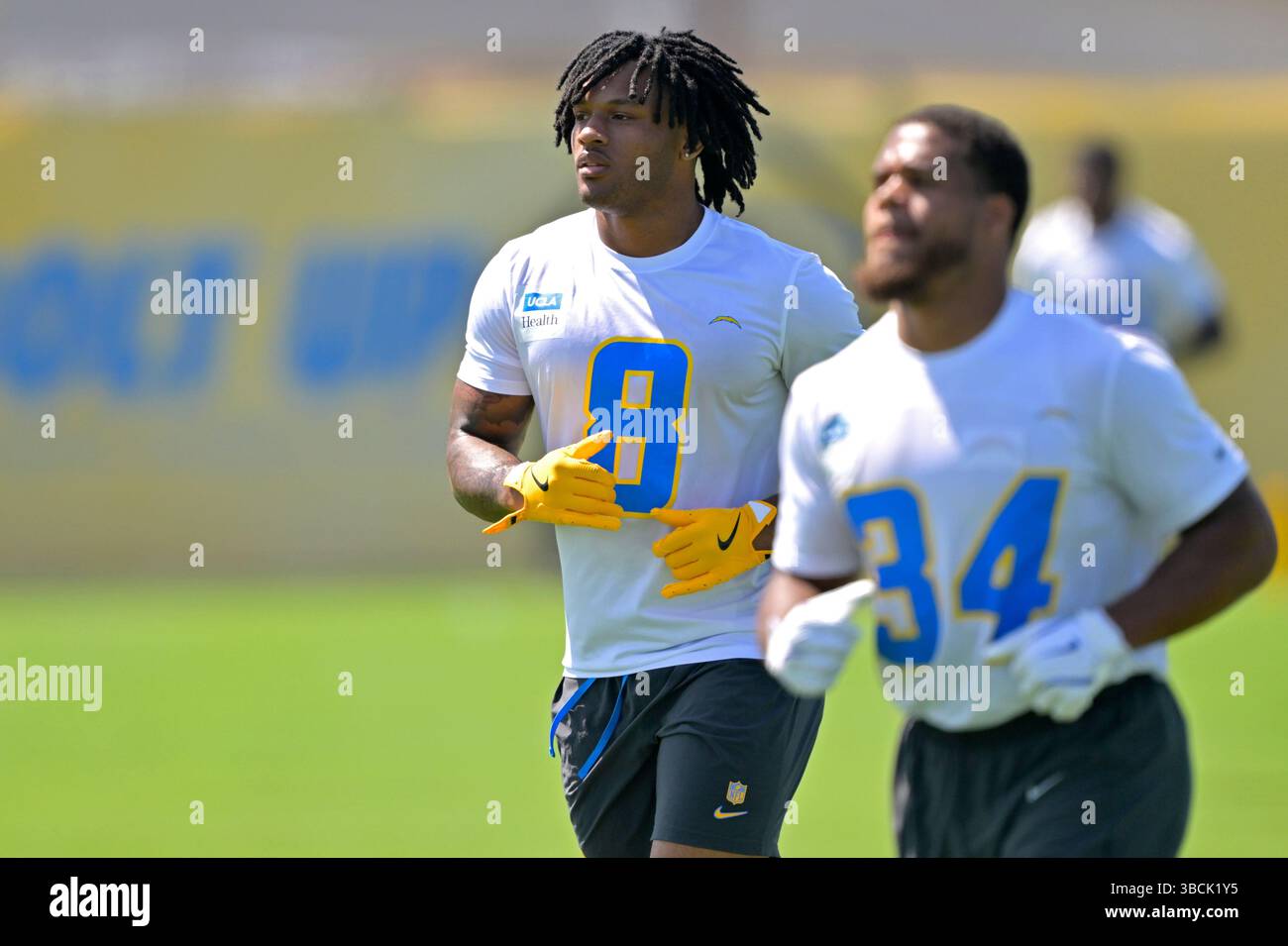 Los Angeles Chargers running back Omarion Hampton (8) jogs on the field ...