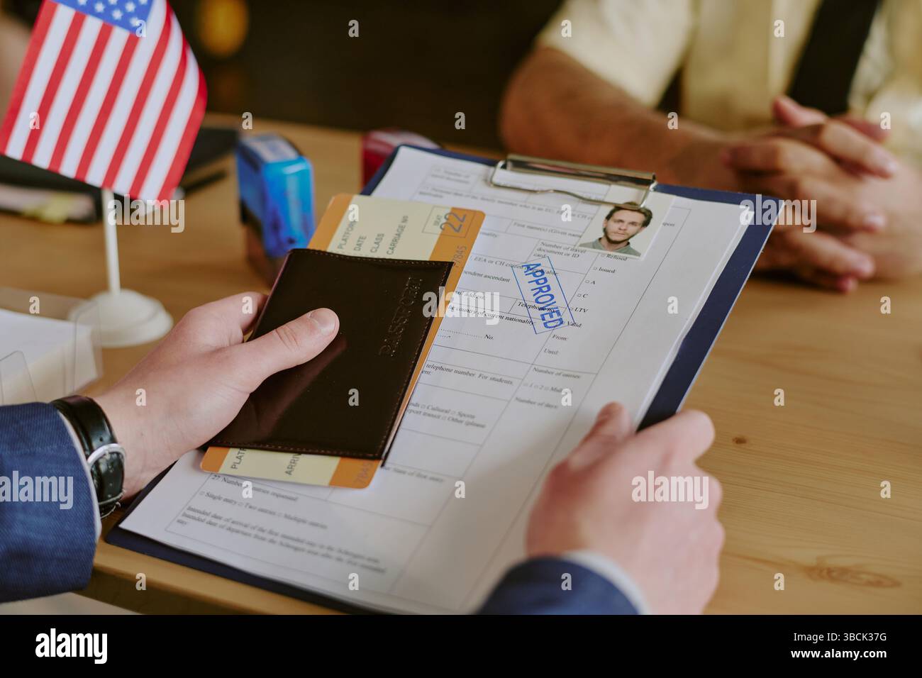 Approving visa application with passport and approved document, focus ...