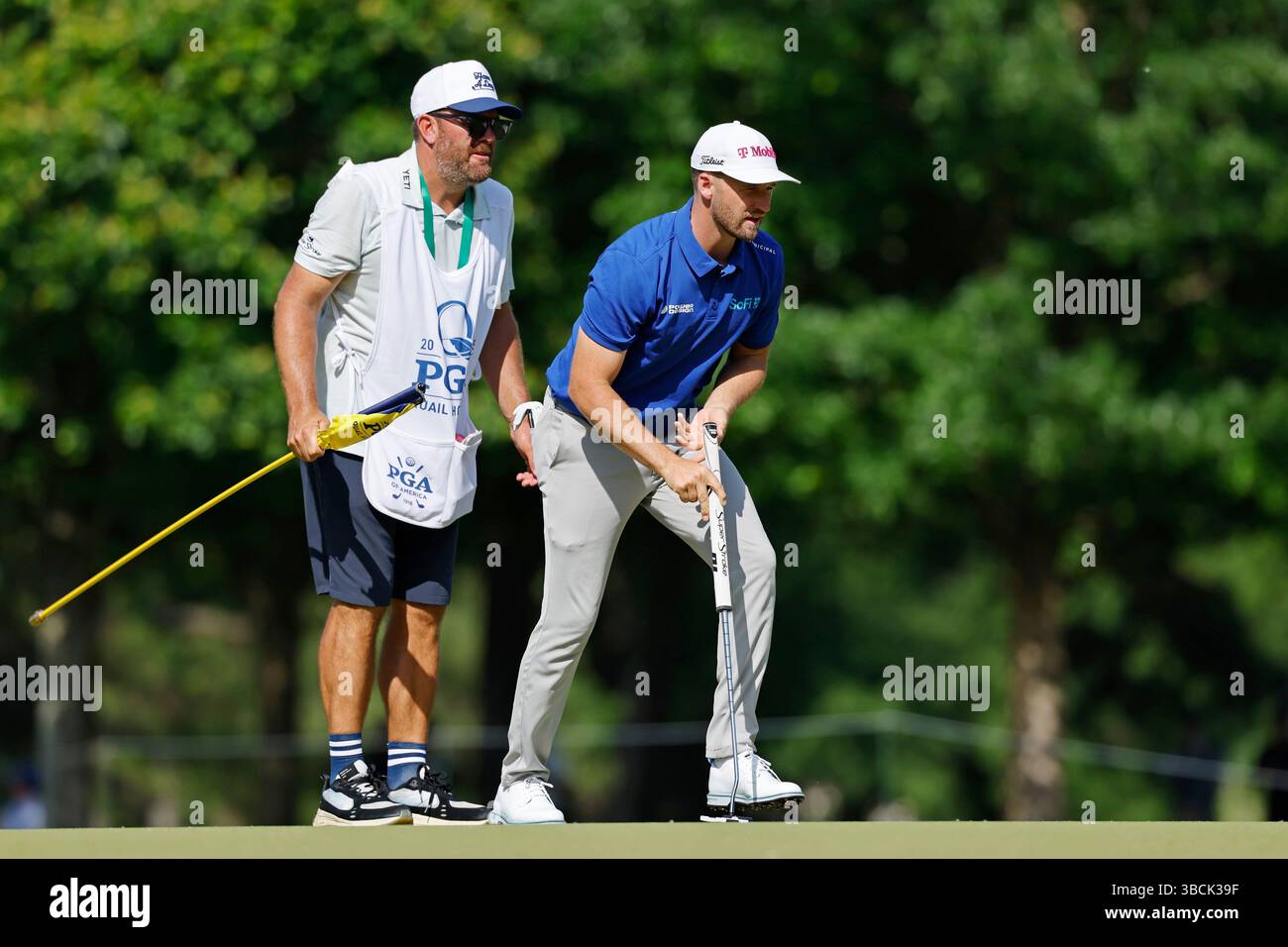 CHARLOTTE, NC - MAY 15: Wyndham Clark (USA) and caddie John Ellis line ...