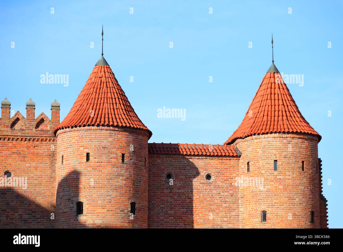 Two castle towers and the blue sky Stock Photo - Alamy