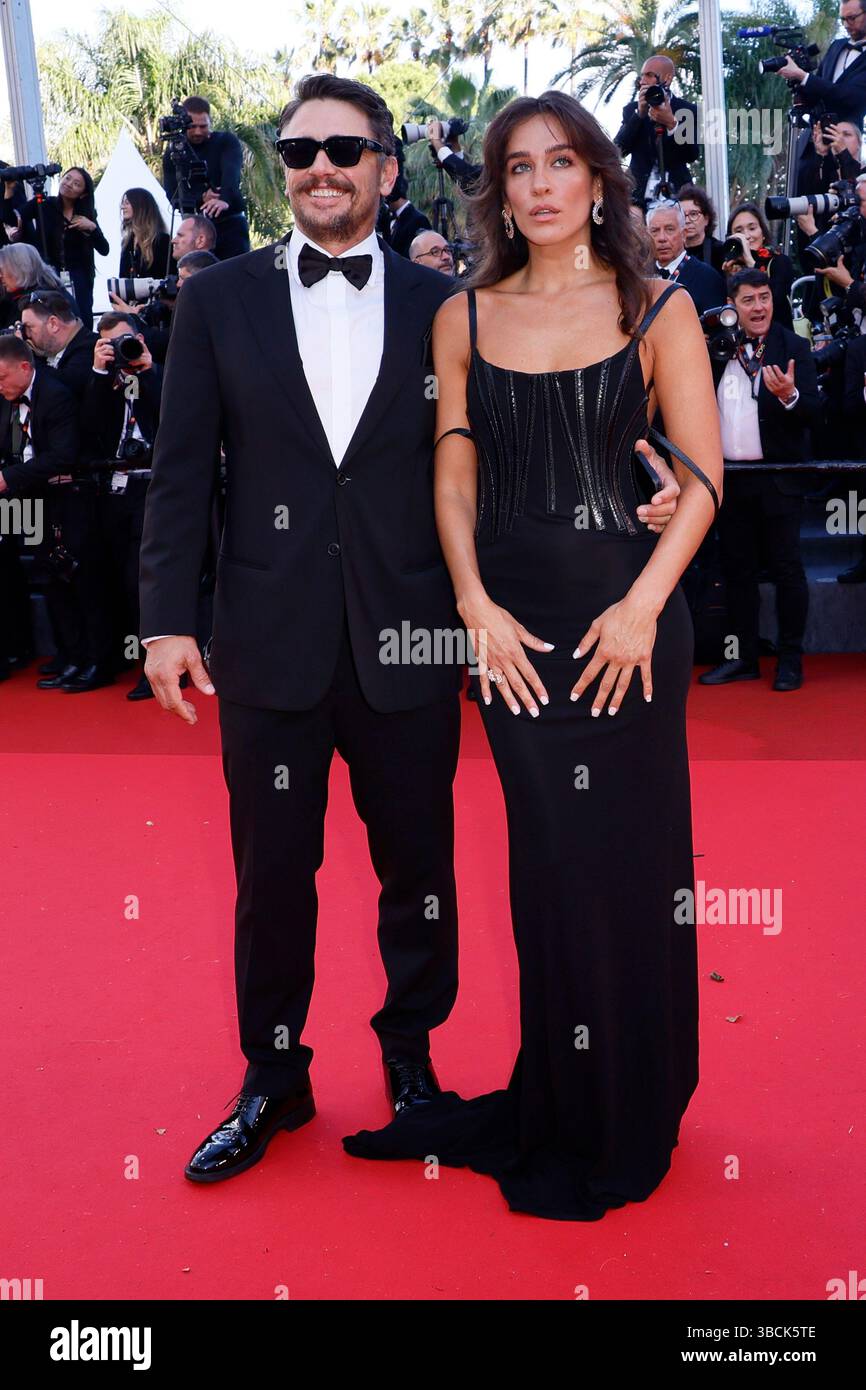 James Franco, left, and Izabel Pakzad pose for photographers upon ...