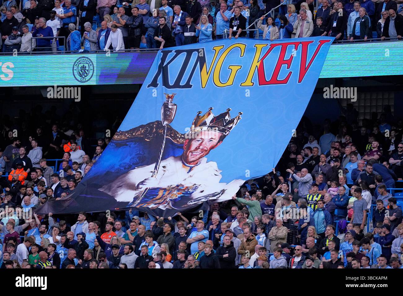 Manchester City fans hold up a Kevin De Bruyne tifo prior to the ...