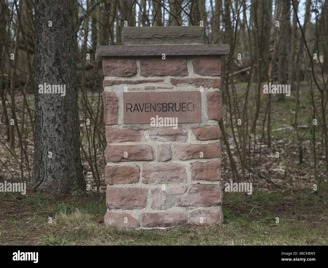 Pillar with inscription Ravensbrueck concentration camp in front of the ...
