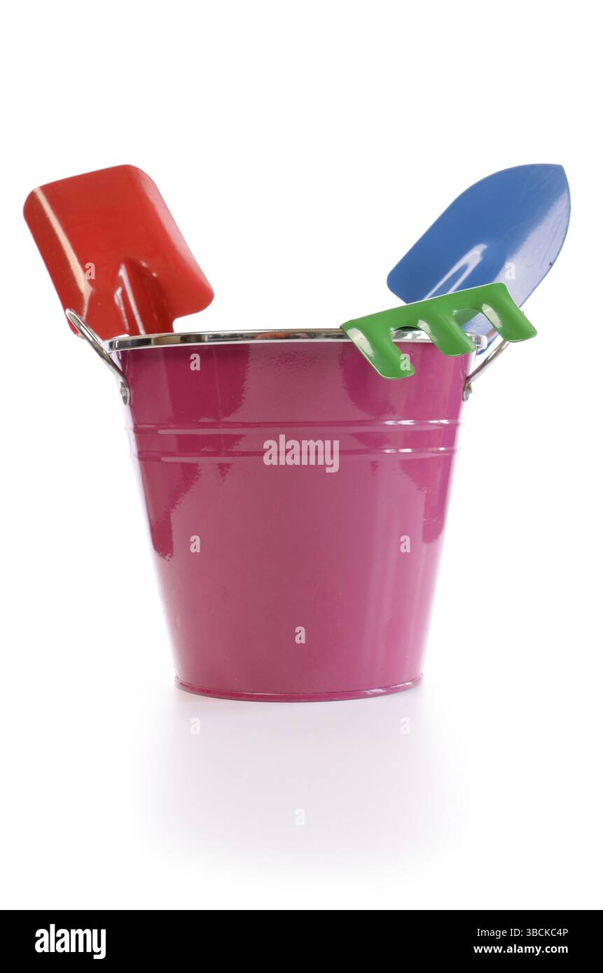 Gardening tools in a violet bucket on a white background Stock Photo ...