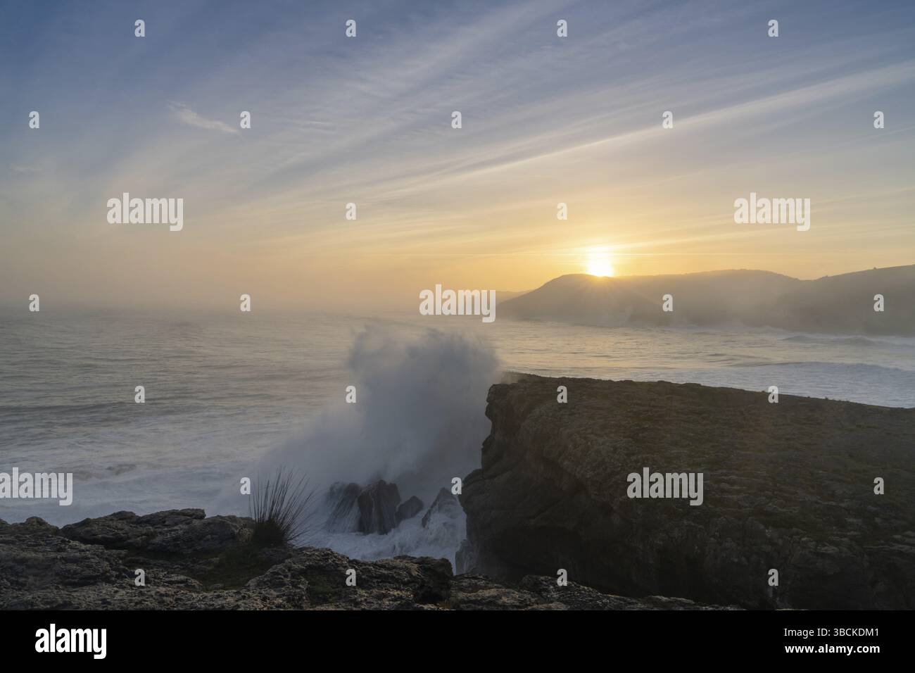A view of huge storm surge ocean waves crashing onto shore and cliffs ...
