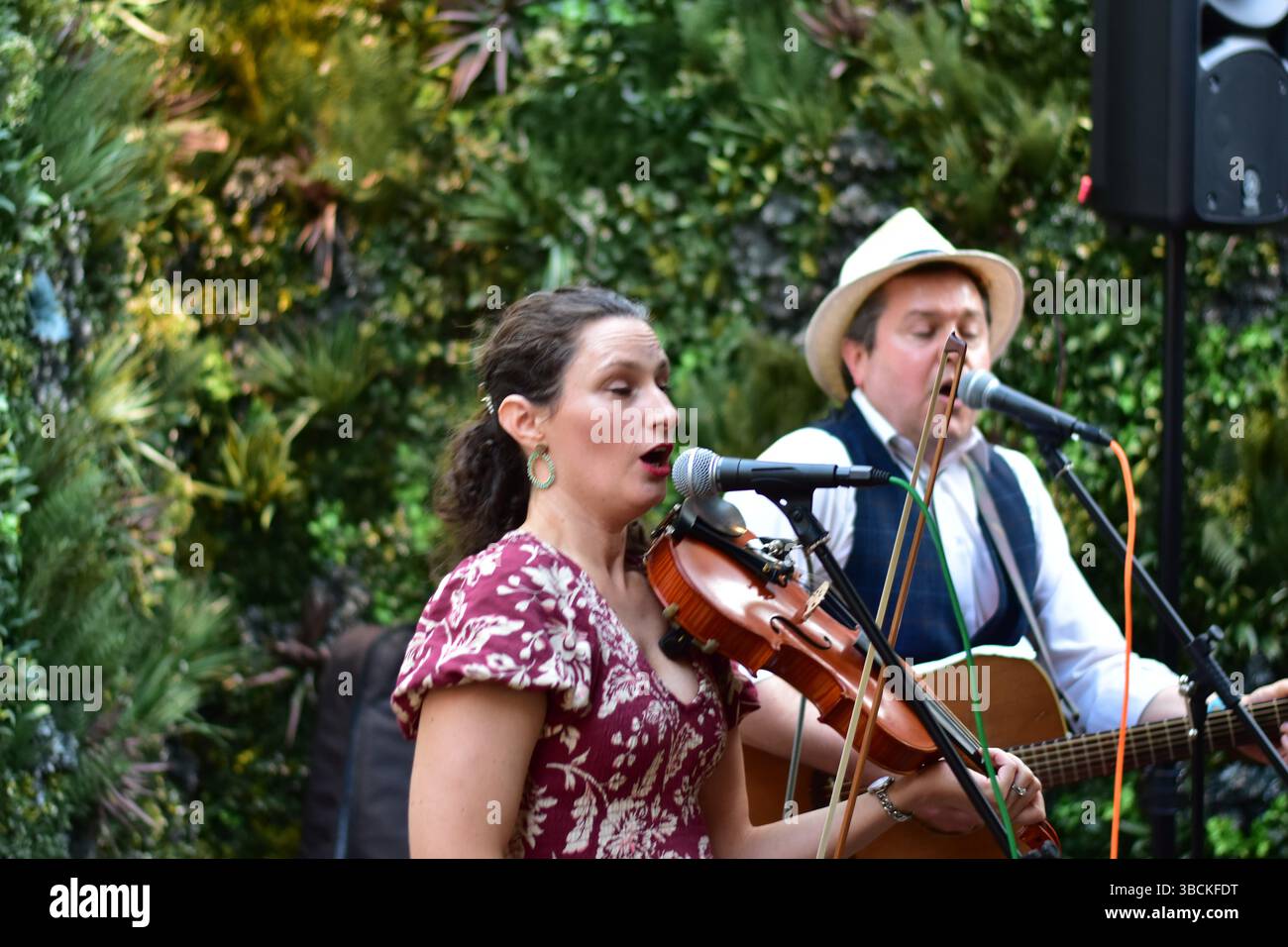Folk artists Fiddle and Strum, a brother and sister duo, in performance ...
