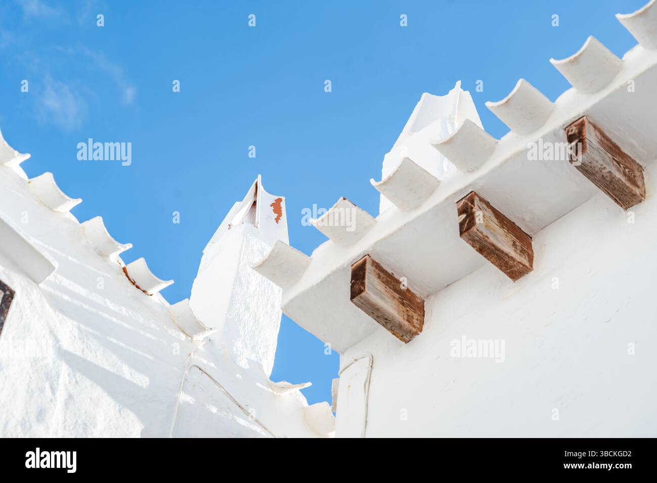 Mediterranean rooftop with traditional curved tiles and wooden beams ...