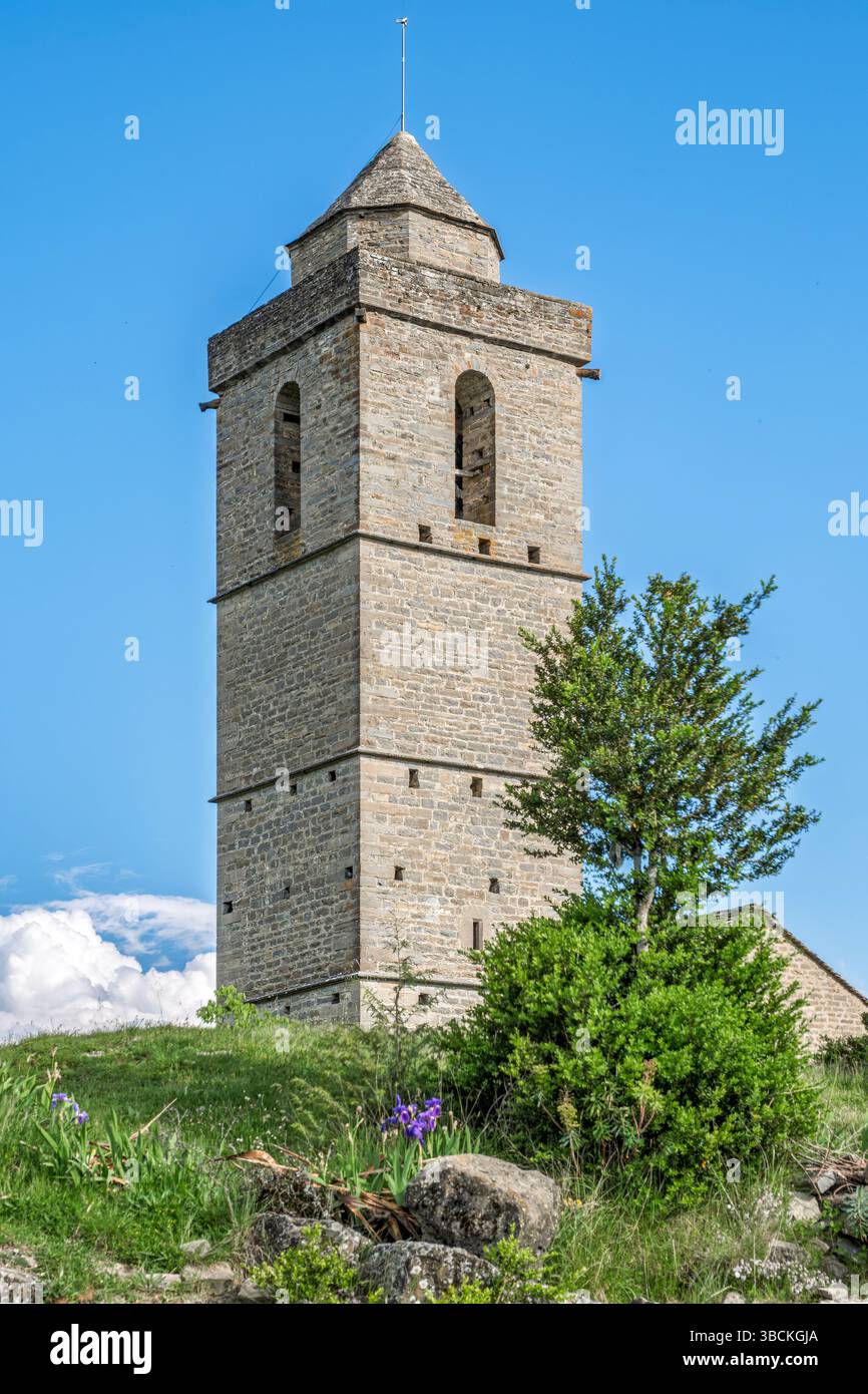 Medieval Stone Bell Tower Of Church In Guaso Huesca Against Blue Sky ...
