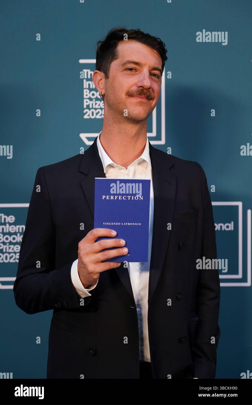 Vincenzo Latronico holds his book 'Perfection' as he poses for ...