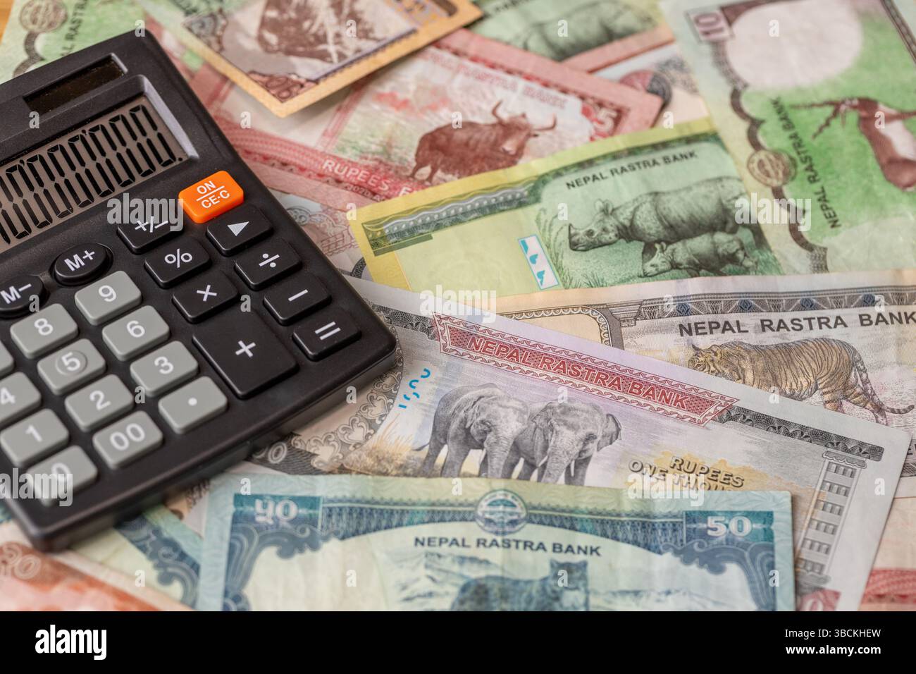 Nepal money, Nepalese rupees and calculator, banknotes, large quantity ...